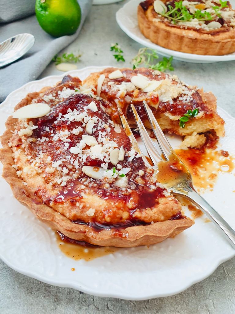 Plum Frangipane Tart With Poached Plums, Jam and Almonds